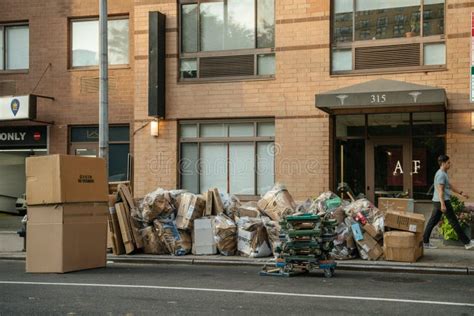 Trash And Cardboard Piles In Front Of City Apartment Editorial Stock