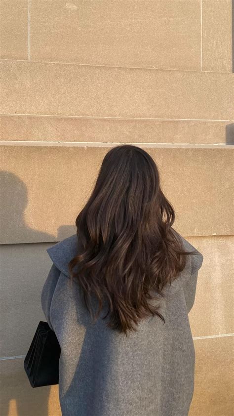 Long Layers V Shaped Cut Side Swept Bangs And An Angle In The Front To