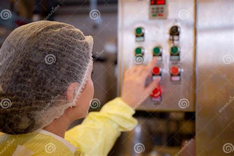 Technician Young Woman Adjust Control Panel Of Machine In Factory For