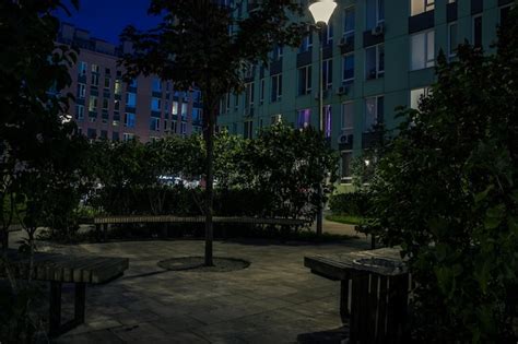 Premium Photo Night Park Paths And Colored Houses At Summer Night