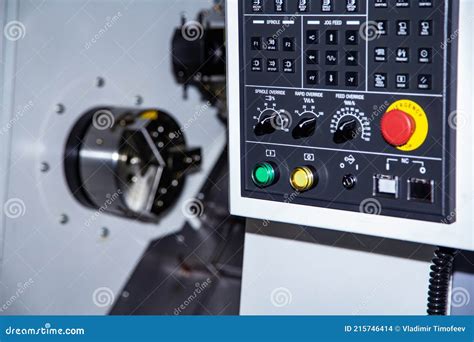 front view of cnc machine control panel and working area of lathe