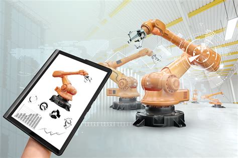 현대 공장에서 로봇 팔을 제어하는 남자의 손에 태블릿 Iot 기술 개념 스마트 팩토리 디지털 제조 운영 산업 40 Stem