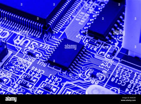 Integrated Semiconductor Microchip On Blue Circuit Board Representative Of The High Tech
