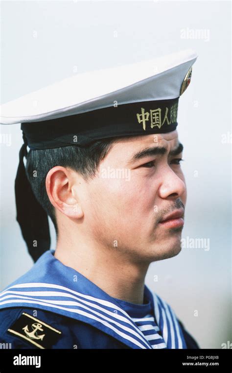 A Chinese Sailor Watches As Us Navy Usn Ships Arrive For The First