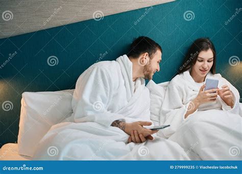 Smiling Man Peeking At His Wifes Phone Stock Image Image Of Smile Gadget