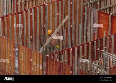 Site Workers Erect Formwork At A Construction Site In Mongkok APR SCMP Jelly Tse Stock