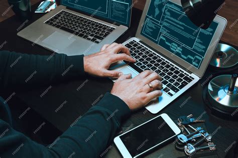 premium photo close up of programmer of hacker hands typing a code
