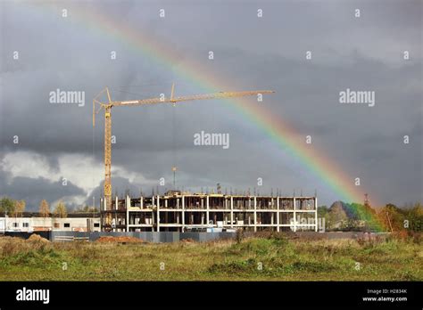 Bright Colorful Wide Colorful Rainbow And A Crane On A Construction