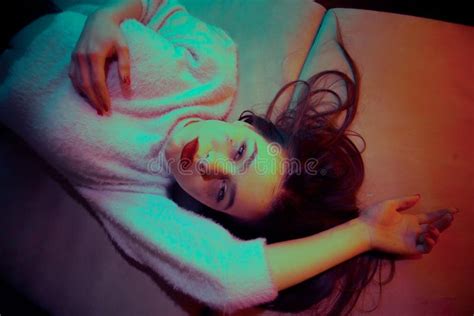 Sexy Beautiful Young Girl Lies On The Couch Seduces With A Look Stock