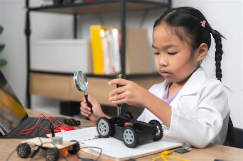 Premium Photo Asian Littlle Girl Constructing And Coding Robot At Premium Photo Asian Littlle Girl Constructing And Coding Robot At