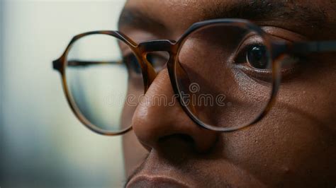 Closeup Portrait Of African American Database Developer With Glasses Working Focused Looking At