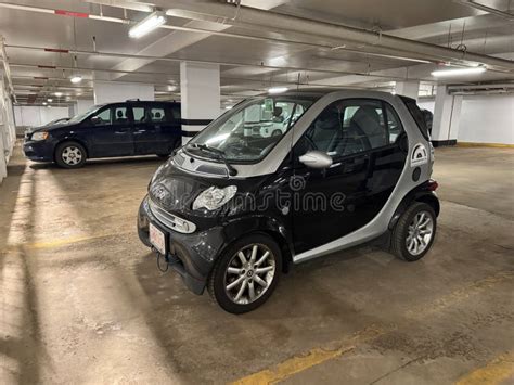 A Compact Smart Fortwo In A Sleek Black And Silver Two Tone Showcases Urban Efficiency