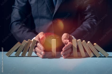 Businessman Hand Protecting Stopping Falling Collapse Wooden Block Domino Risk And Strategy