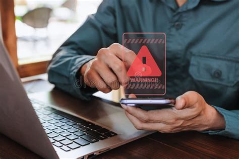 Businessman Using Computer Laptop And Smartphone With Caution Warning