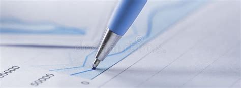 Accounting Document With Pen Money Coins And Checking Financial Chart
