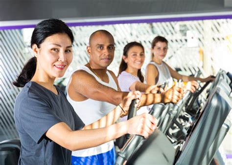 People Having Running Elliptical Trainer Class In Club Stock Image Image Of Slim Pastime