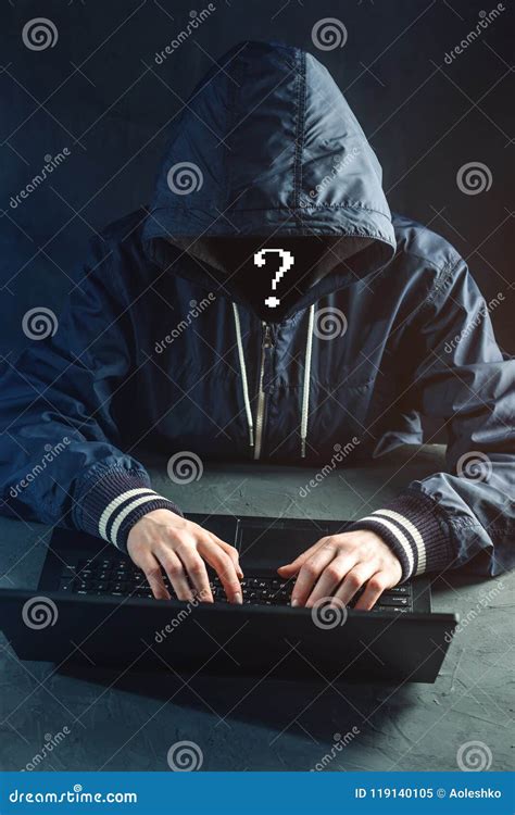 Anonymous Hacker Programmer Uses A Laptop To Hack The System Stealing