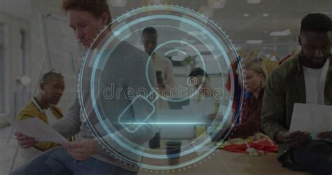 Animation Of Cyber Security Text And Magnifying Glass Over Diverse Designers Working In Office