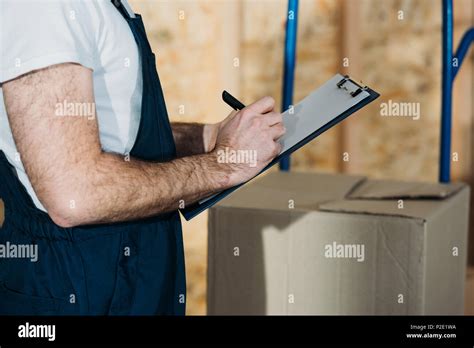 Delivery Man Filling Cargo Declaration Stock Photo Alamy