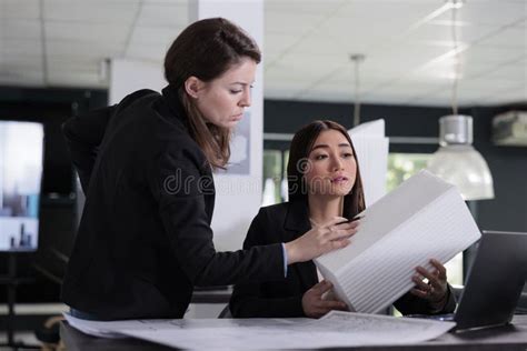 Architects Working With Blueprints Discussing Architectural 3d Model Stock Image Image Of