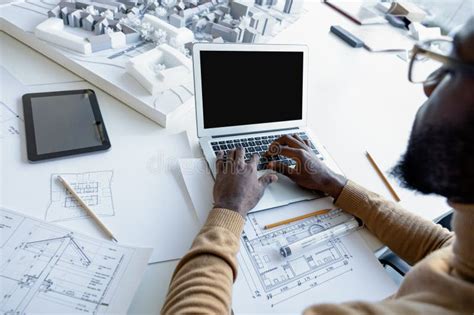 creative man architect using computer for design and architect work in
