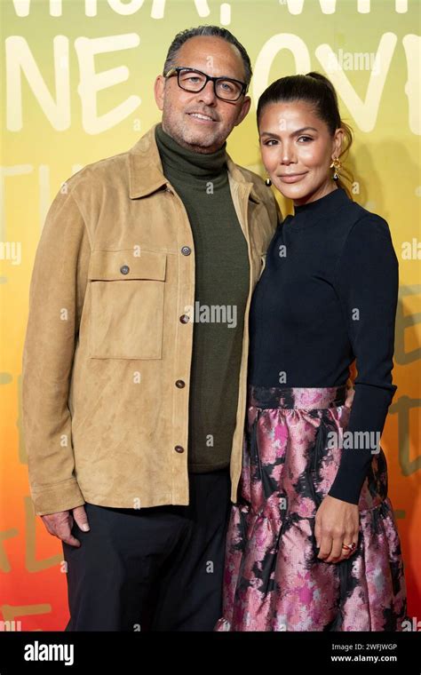 Bob Teitel Left And Michelle Alegria Pose For Photographers Upon Arrival At The Premiere Of