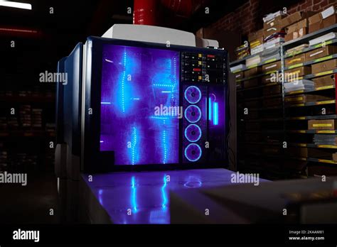 Background Image Of Factory Workshop With Focus On Machine Glowing In Dark Copy Space Stock