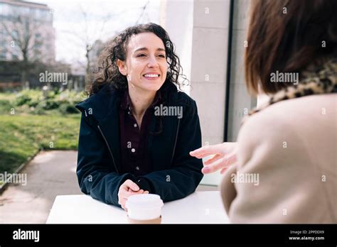 Happy Aunt And Niece Sitting At Outdoor Cafe Stock Photo Alamy