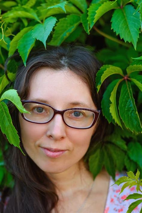 Portrait Of Ordinary Mid Adult Pretty Woman Smiling At Camera Stock
