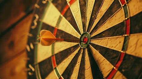 Close Up Of A Dart Hitting The Bullseye On A Dartboard Showcasing