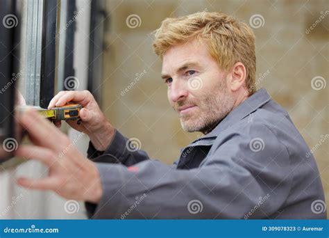 Service Man Installing Window With Measure Tape Stock Image Image Of Install Tapeline 309078323