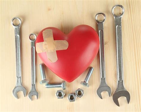 Premium Photo Heart And Tools Concept Renovation Of Heart On Wooden Background