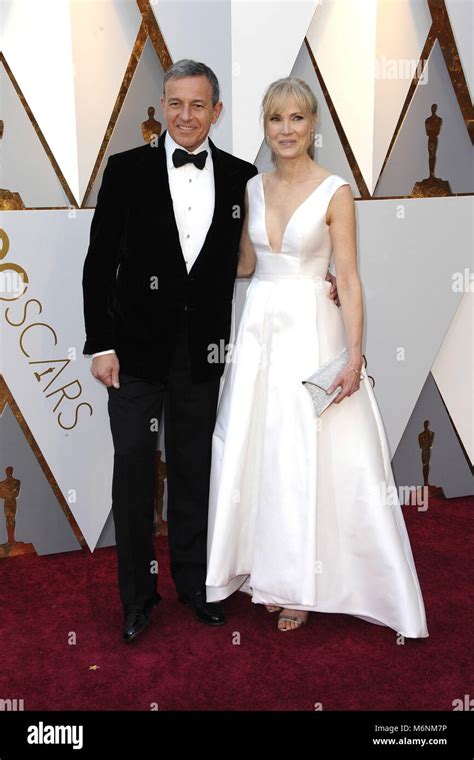 Roger Iger And Willow Bay Attending The 90th Annual Academy Awards At