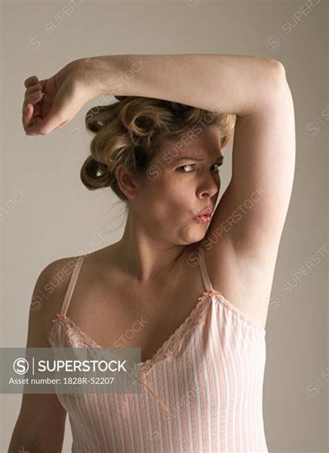Woman Smelling Armpit Superstock