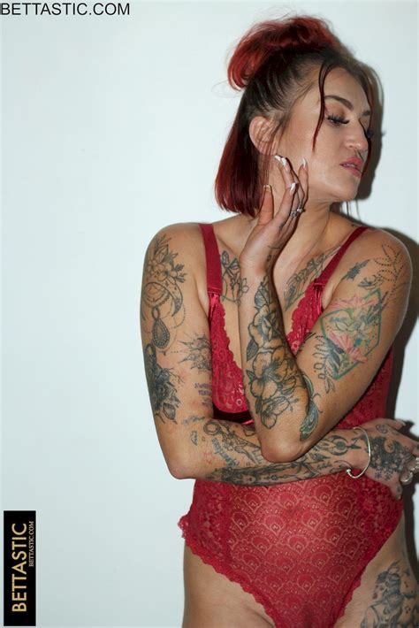 Tattooed Amateur Poses While Wearing Red Lingerie 15 Photos