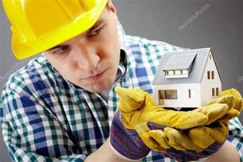 Constructor With House Model Stock Photo By Pressmaster