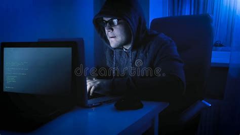 Portrait Of Hacker Working At Night And Typing Program Code On Laptop Stock Photo Image Of