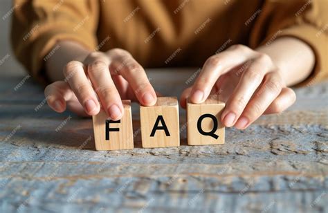 Premium Photo Female Hands Make Word Faq On Wooden Cubes Frequently Asked Questions Concept
