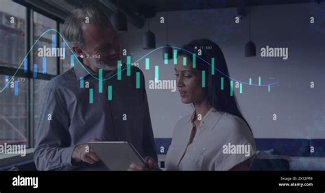 Image Of Data Processing Against Diverse Man And Woman Discussing Over A Tablet At Office Stock