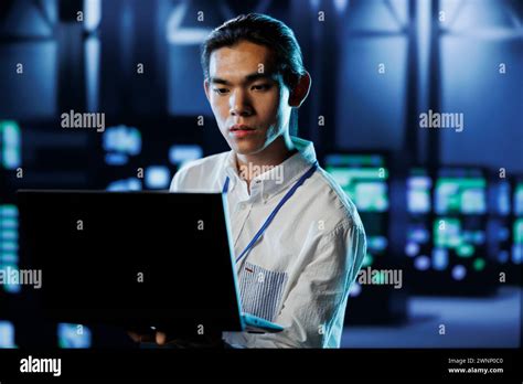 Qualified Engineer Between Server Hub Rows Providing Processing Resources For Businesses