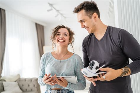 Man And Woman Couple Wife Husband Set Up Surveillance Security Camera