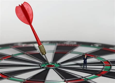 An Entrepreneur Looking At Arrows On A Dartboard Concept Of Business Marketing Plans And