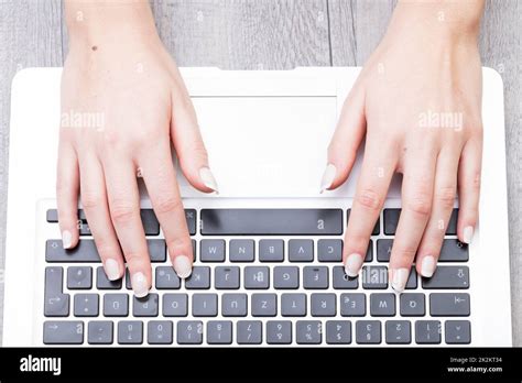 Woman Typing On A Laptop Keyboard Stock Photo Alamy