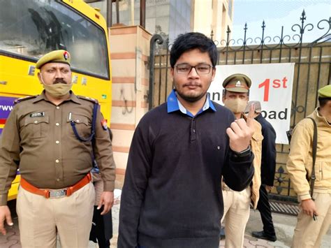 first time voter aditya jha shows his inked mark finger after cast his