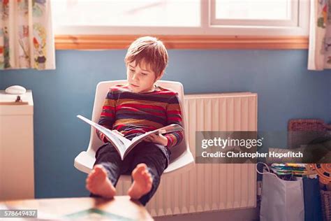 Barefoot Boys Reading Photos And Premium High Res Pictures Getty Images