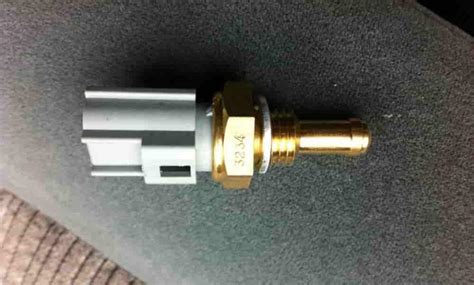 Где находится датчик температуры охлаждающей жидкости