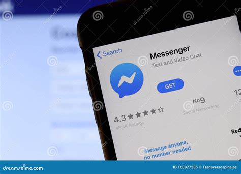 Mobile Phone With Messenger Icon On Screen Close Up With Website On