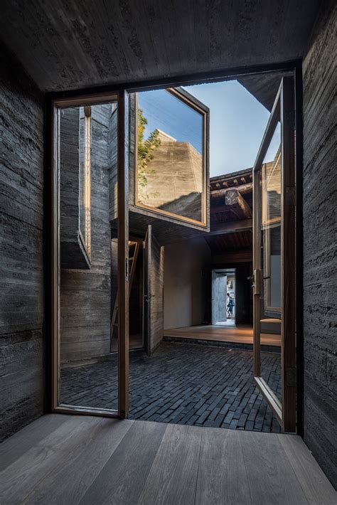 Micro Hostel With Tiny Concrete Rooms Installed By Zhang Ke In Old Beijing Hutong