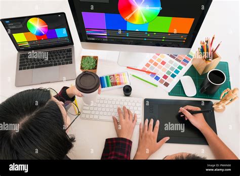 top view graphic designer working with computer on artist workplace