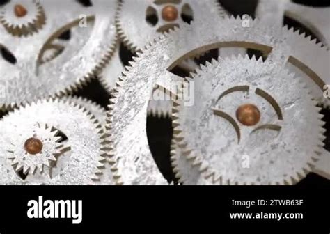 The Camera Moves Along The Rotating Gears And Focuses On The